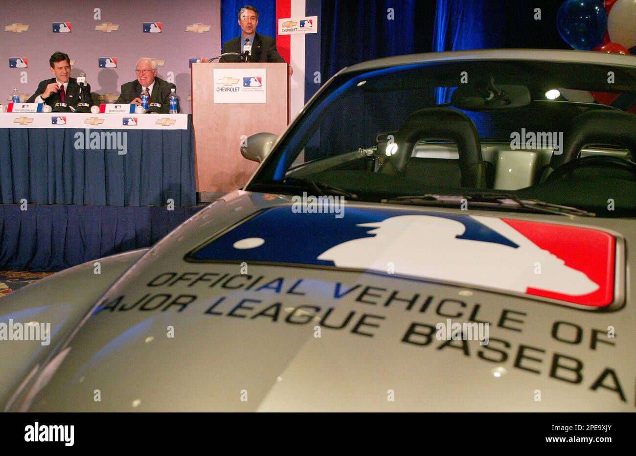 Steve Tihanyi, at podium, of General Motors, Bob DuPuy, President and ...