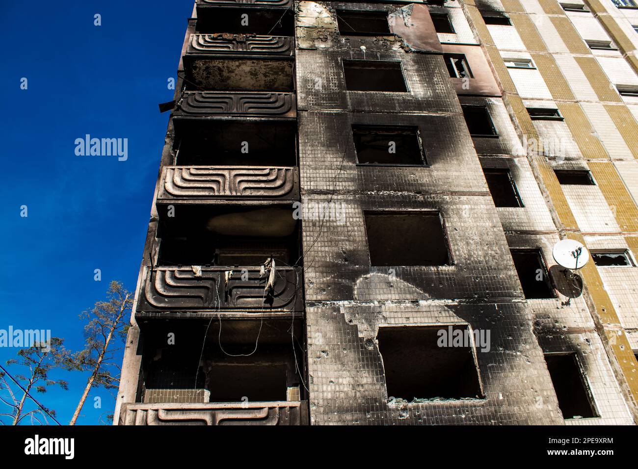 Close-up of the windows of the facade of a building that burned after ...