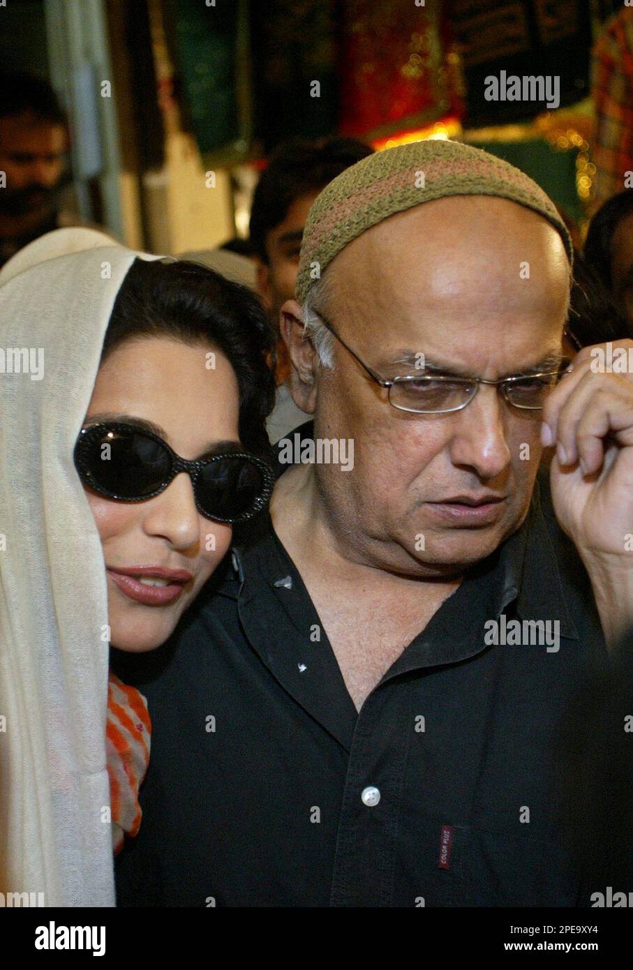 Pakistani actress Meera, left, poses next to Indian Bollywood director ...