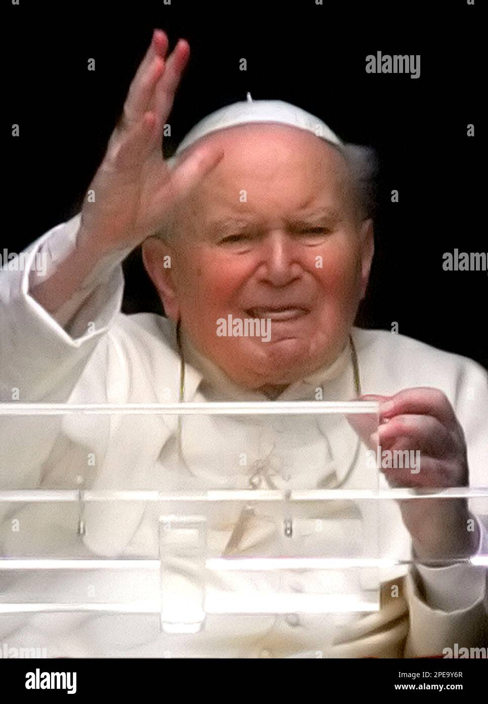 Pope John Paul II gives his blessing as he appears at the window of his ...