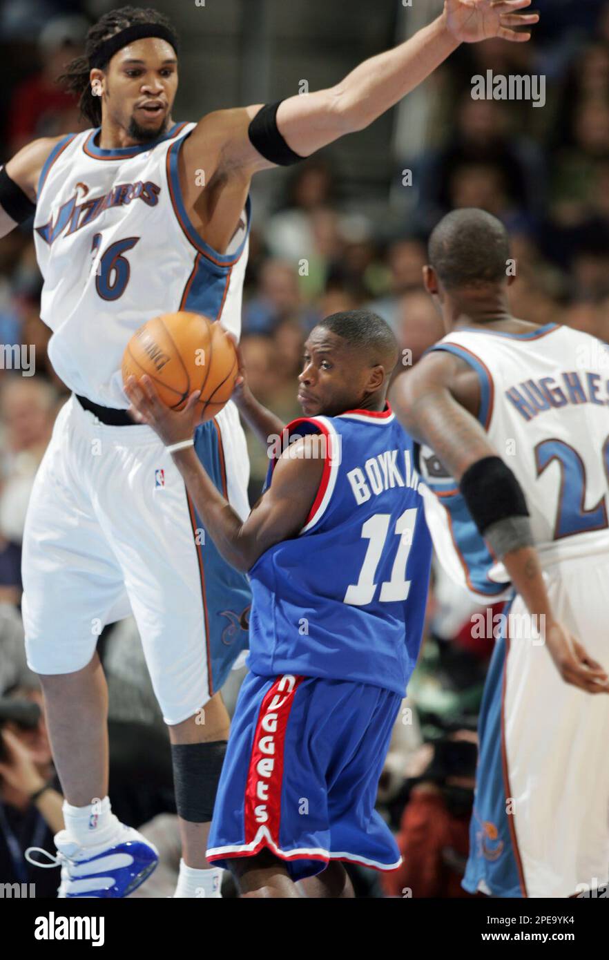 Denver Nuggets guard Earl Boykins, center, is caught with the ball by ...