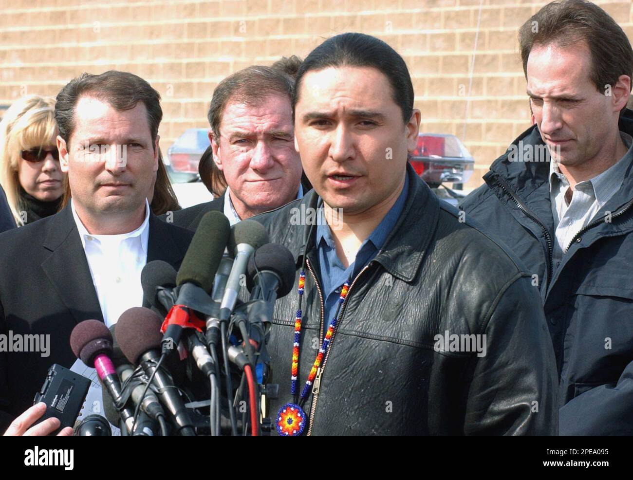 FBI agents Michael Tabman, right, and Paul McCabe, left, listen as ...