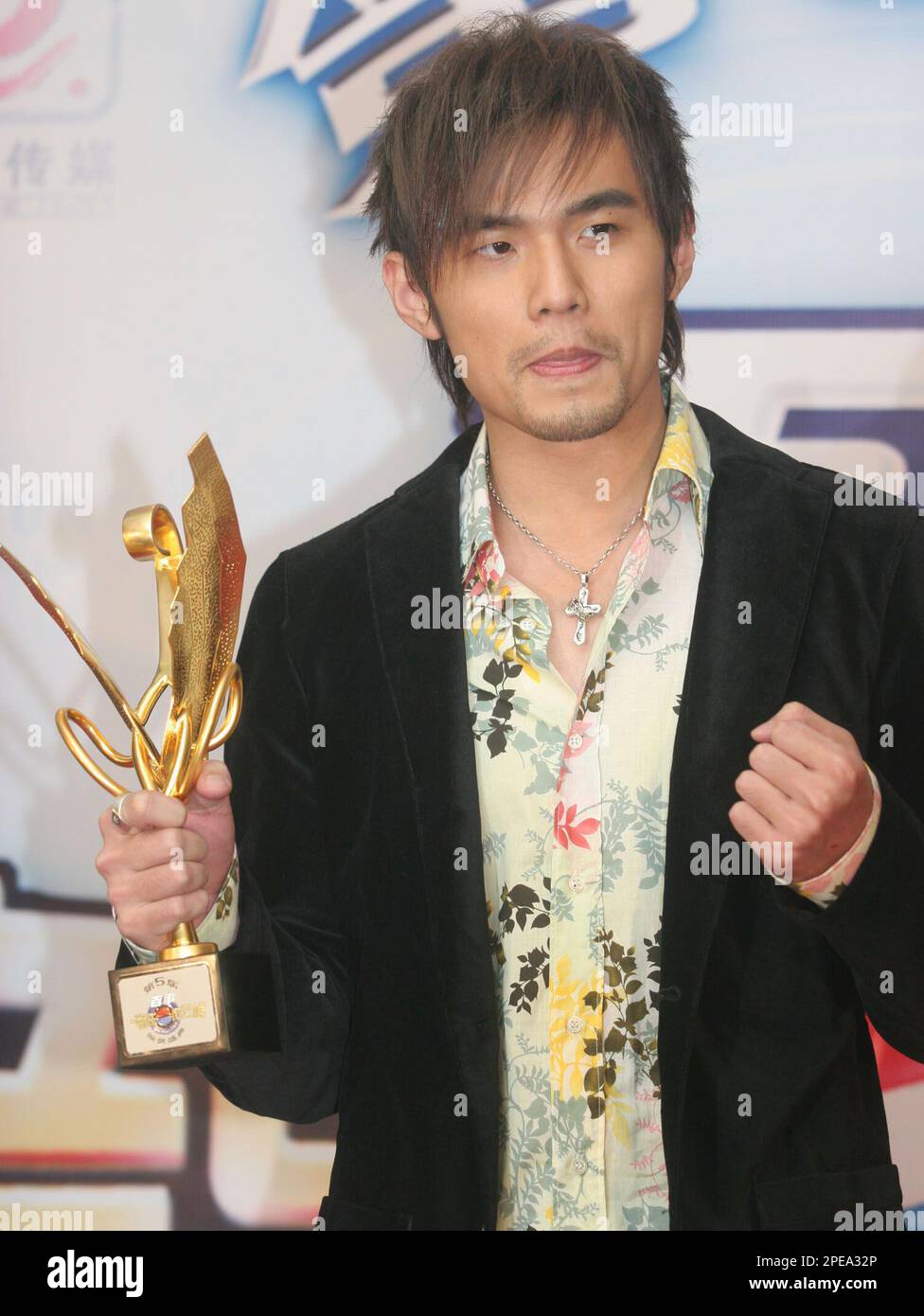 Taiwanese singer Jay Chou displays one of his trophies after winning ...