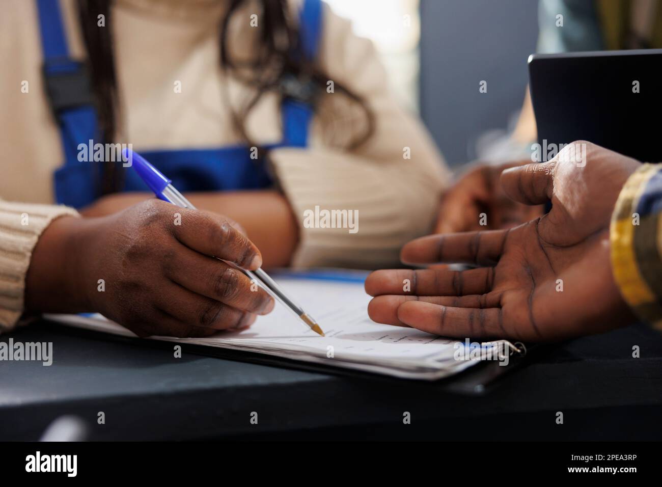 African american delivery service worker searching parcel code in ...