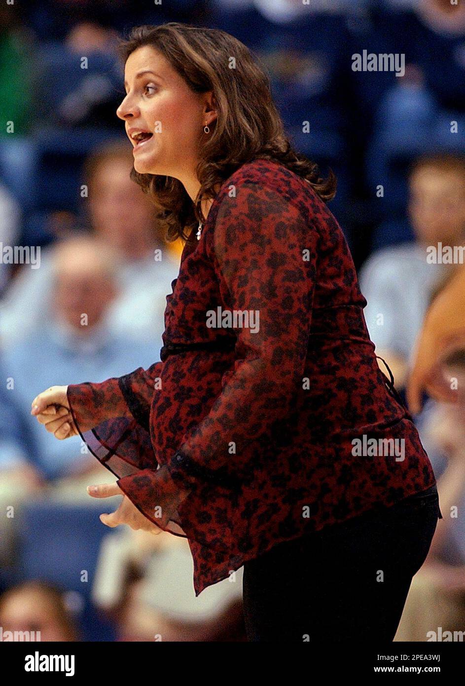 Hartford head coach Jennifer Rizzotti directs her team from the bench ...