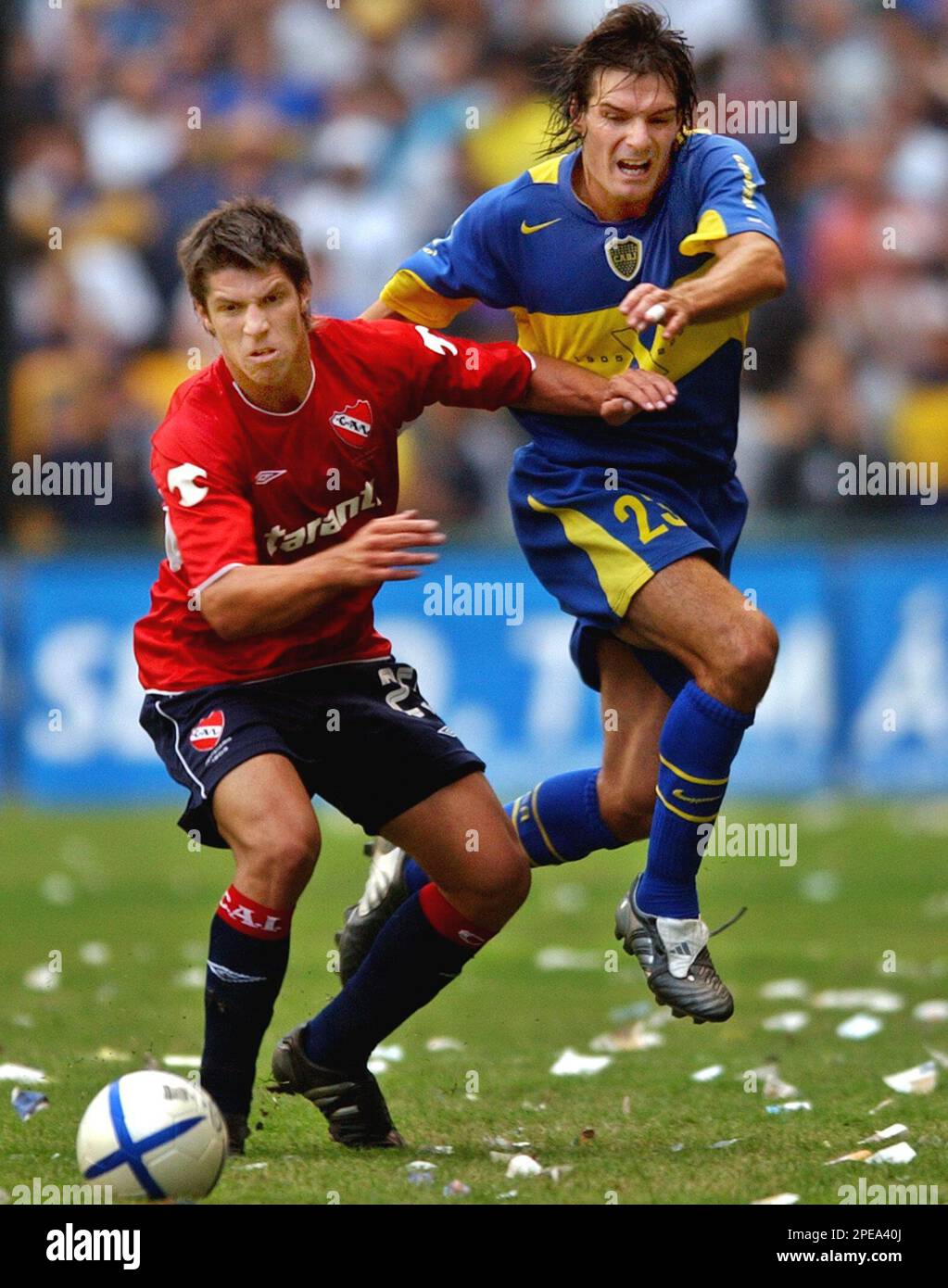 Independientes Lucas Biglia, left, fights for the ball with Andres ...