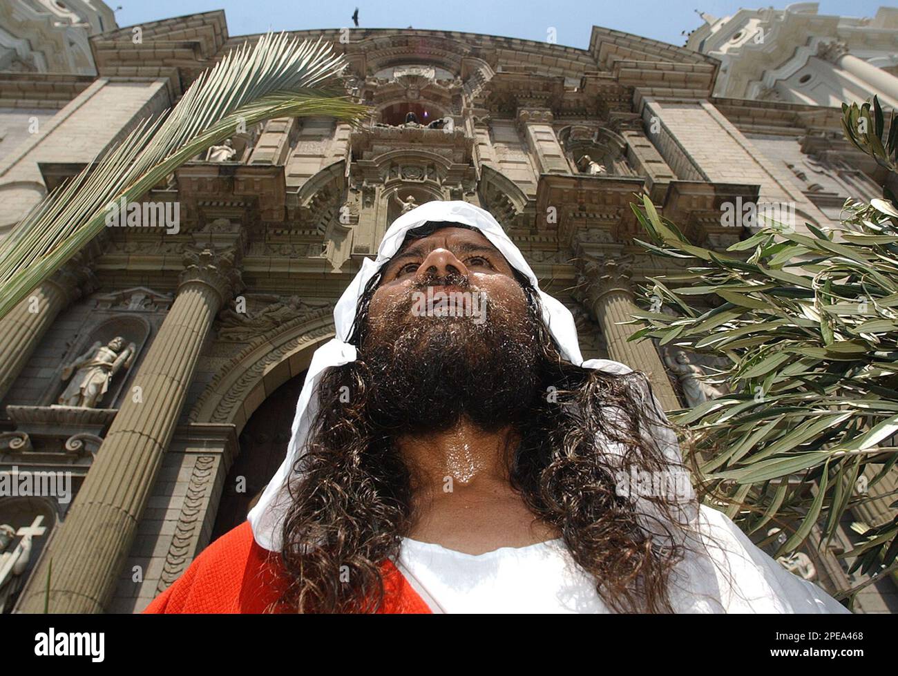 Mario Valencia, dressed like "Jesus" pray in front of the Lima's ...
