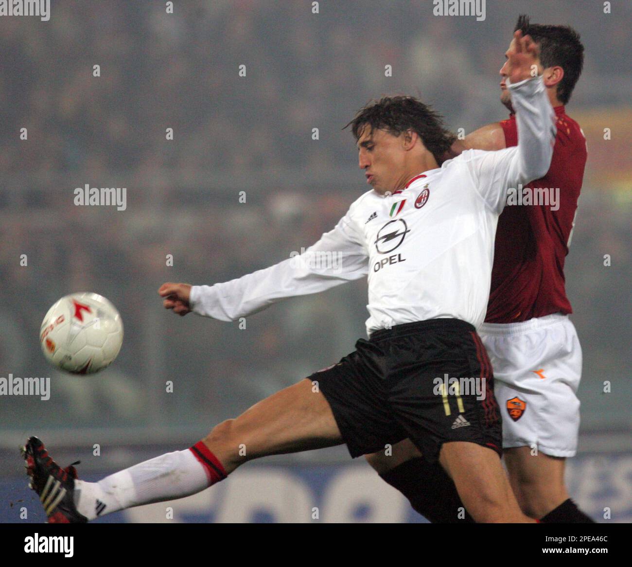 AS Roma's defender Cristian Chivu of Romania, right, tackles AC Milan's ...