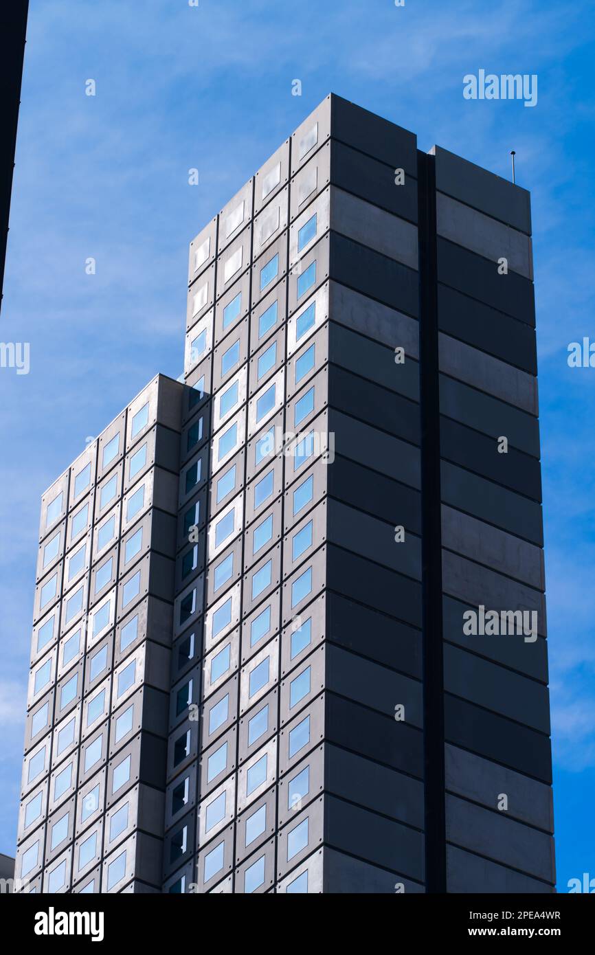 Melbourne apartment building exterior view with a blue sky background ...