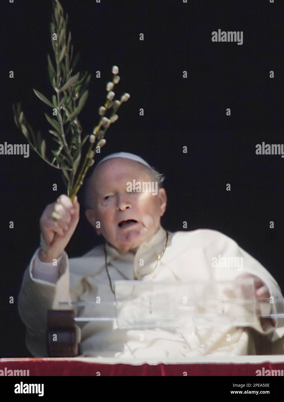 Pope John Paul II's waves an olive branch as he appears at the window ...