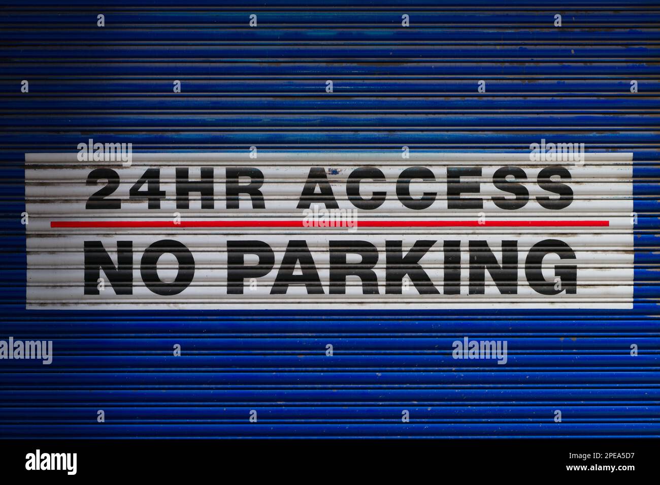 No parking sign at anytime and 24 hour access on blue painted metal ...