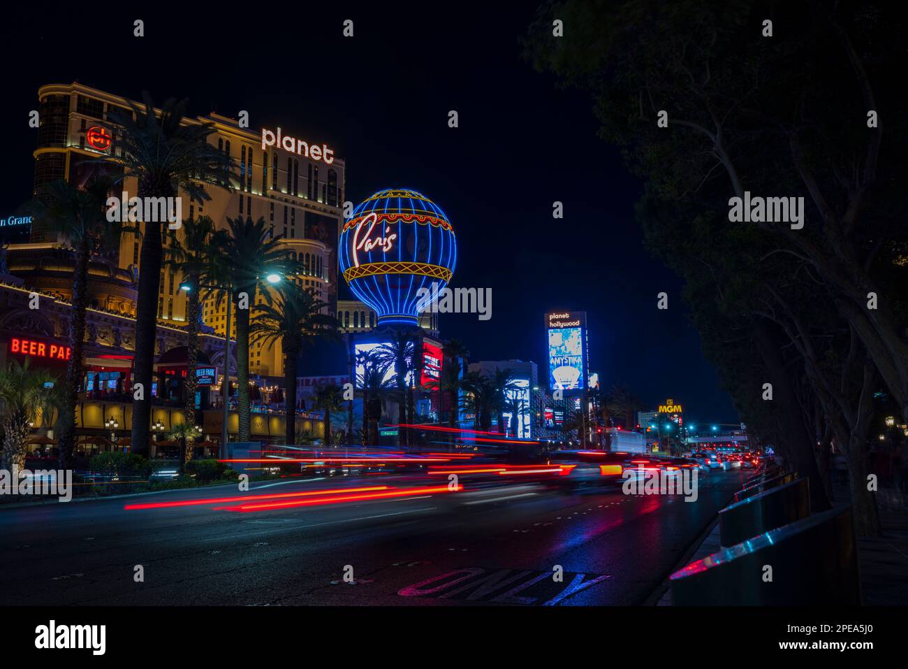 Beautiful out-of-focus strip road tracers. Night view of Las Vegas cityscape with gorgeous ...