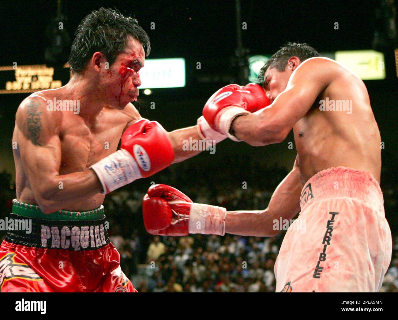 Manny Pacquiao, of the Philippines, lands a left to the face of Erik ...