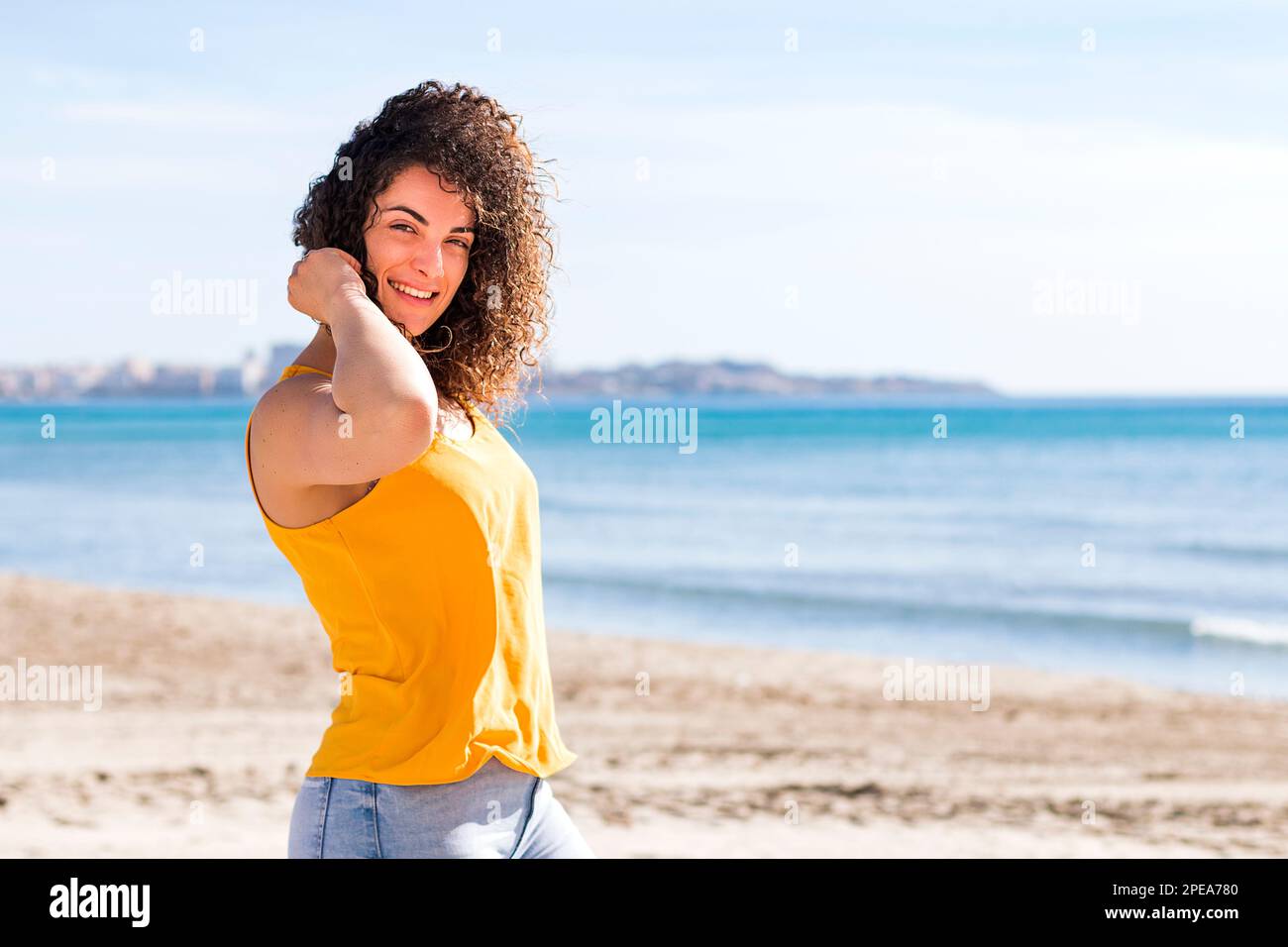 Cheerful young female curly hair hi-res stock photography and images ...
