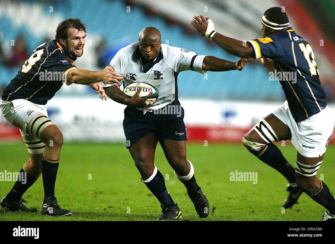 South Africa's Cats Lawrence Sephaka, center, attemps to break through ...