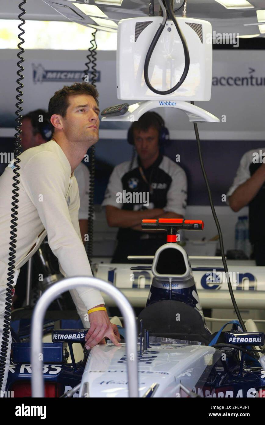 Williams BMW F1 driver Mark Webber of Australia monitors the Malaysian ...