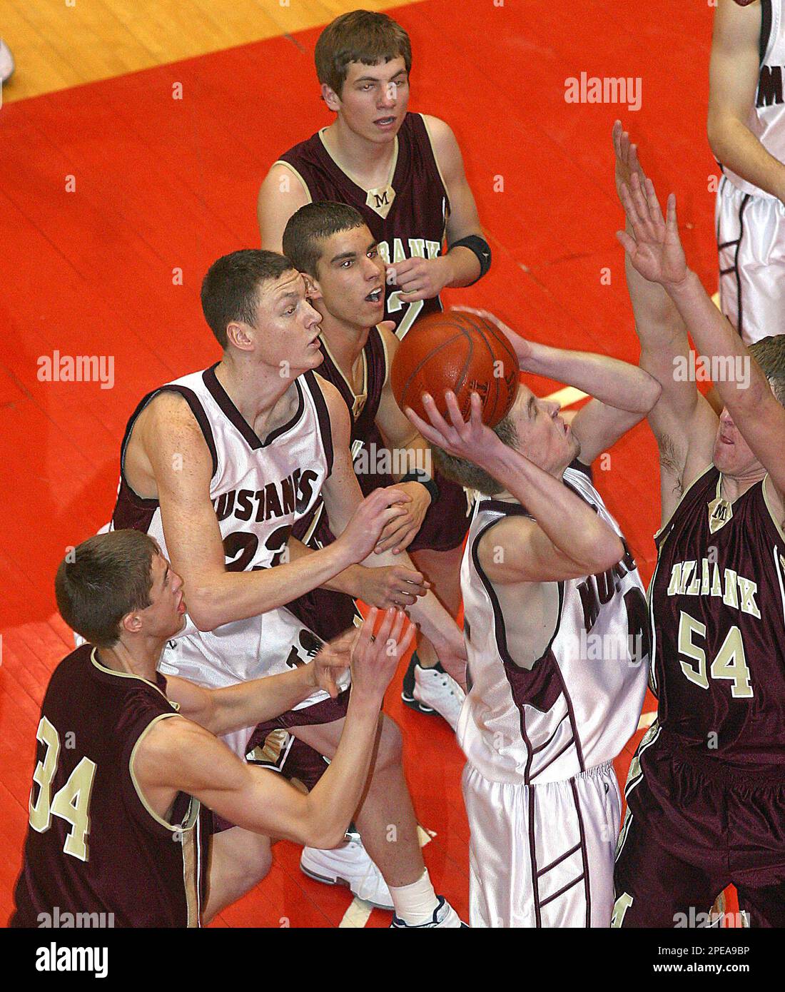 Tri-Valley's Jay Tennesson, center, tries to get a shot off in a crowd ...
