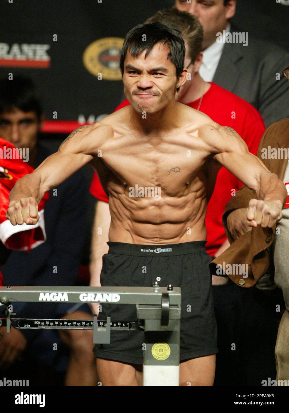 Manny Pacquiao, of the Philippines, poses on the scale after weighing ...