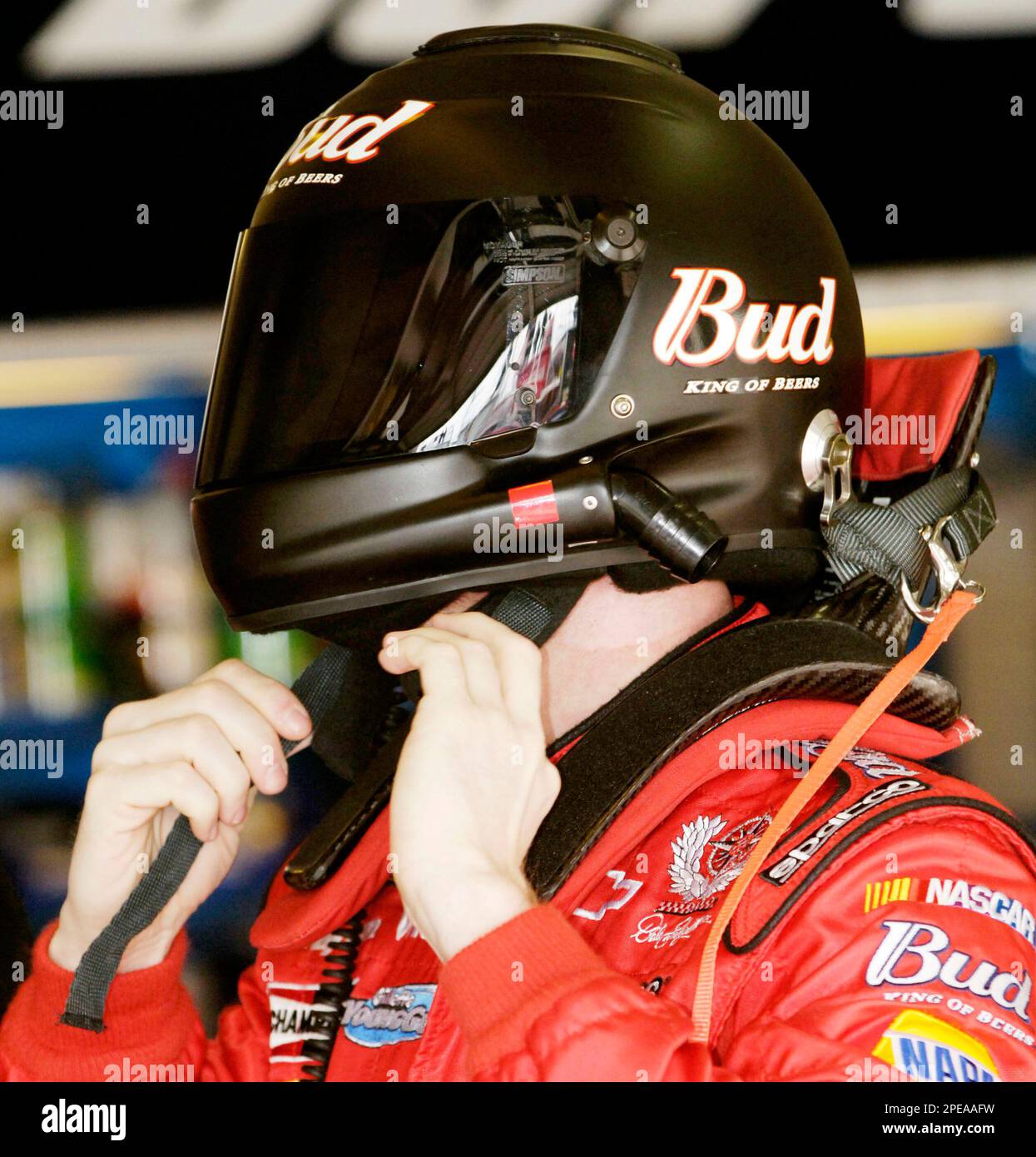 NASCAR driver Dale Earnhardt Jr. adjusts his helmet as he gets ready ...