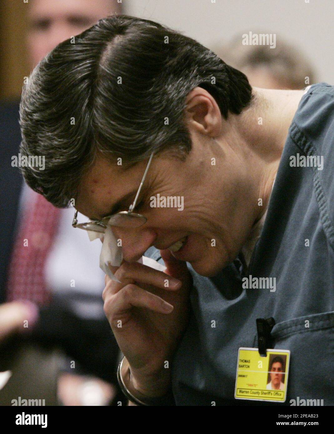Former Springboro police officer Jim Barton wipes away a tear as he ...
