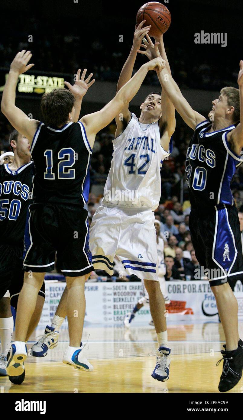 Capital's Isaac Holstein (42) battles Buckhannon Upshur's Ryan Godwin ...