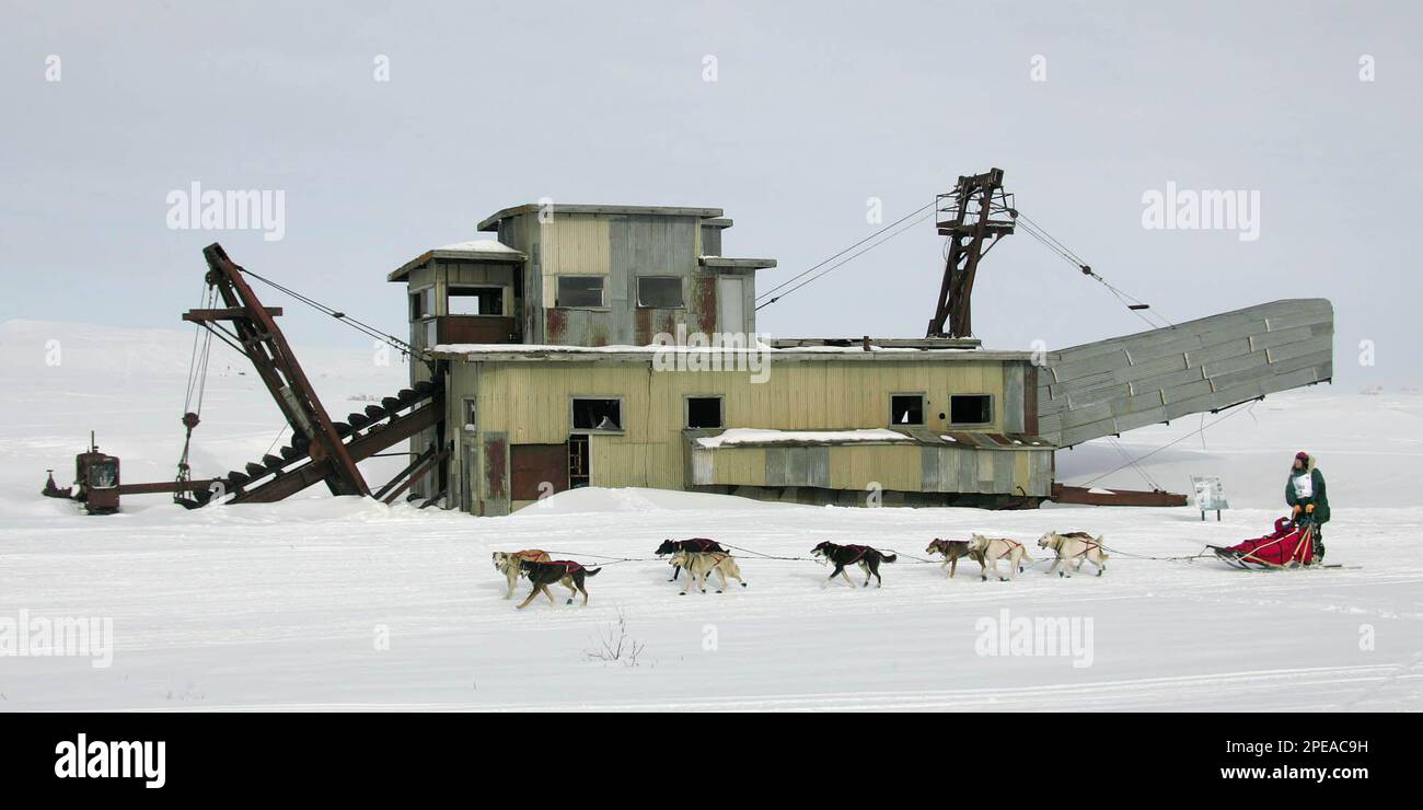 Peter Bartlett passes the historic Swanberg's Dredge outside of Nome ...