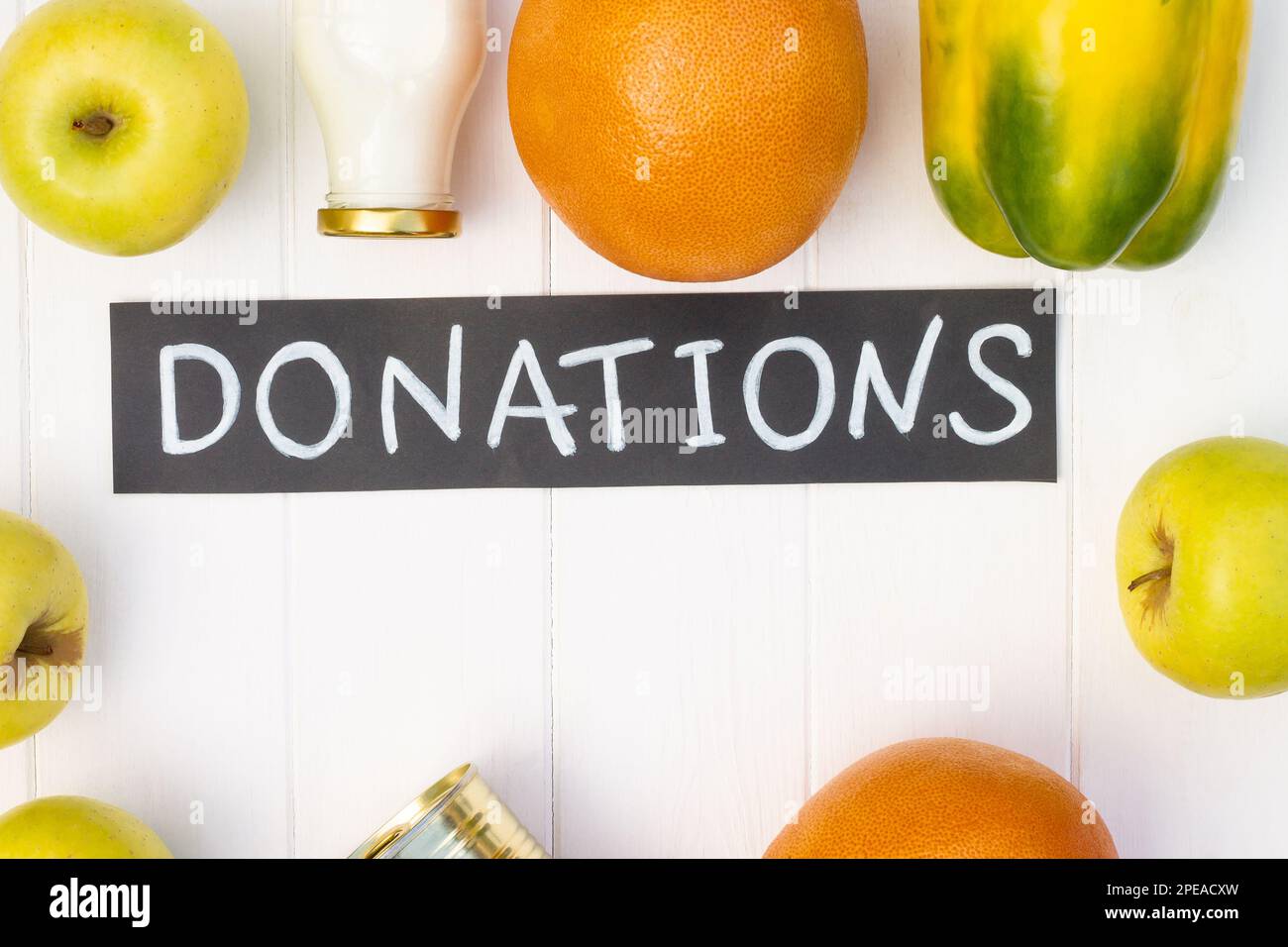 Cereals, canned food, milk, vegetables and fruits with a chalk ...