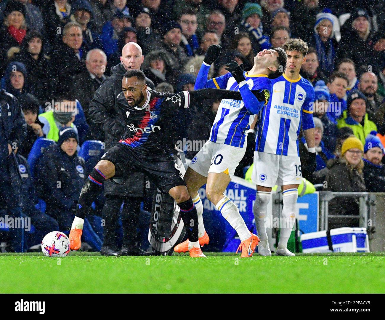 Jordan Ayew of Crystal Palace hits Julio Enciso of Brighton and Hove ...