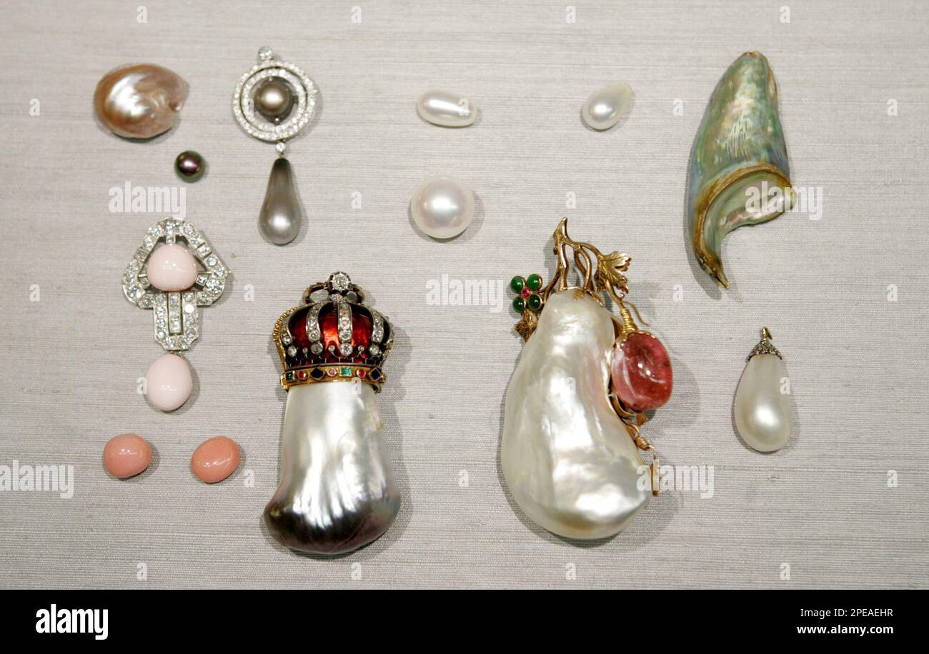 The Hope Pearl, with crown, left, and the Pearl of Asia, second from ...
