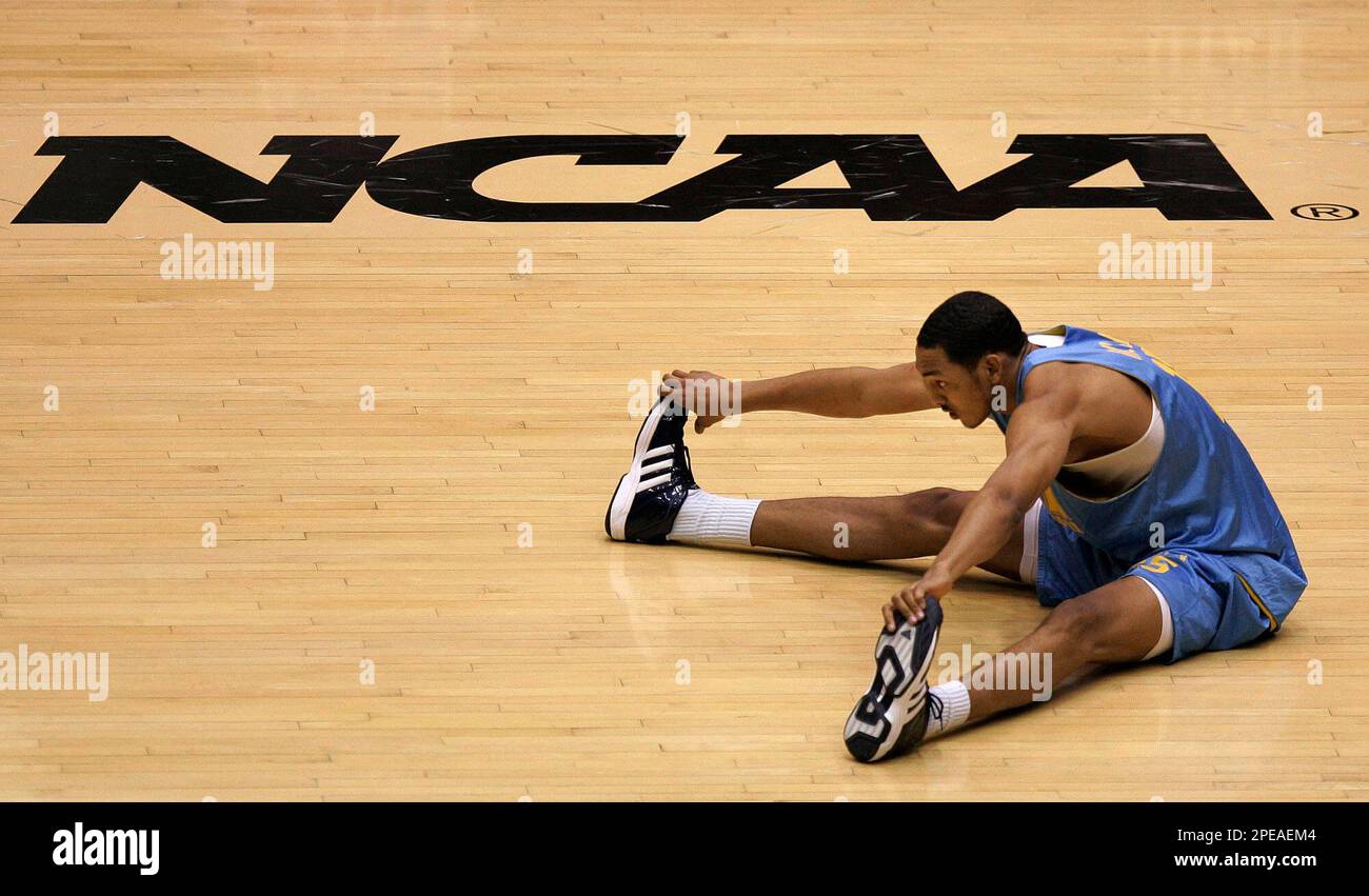 UCLA center Ryan Hollins stretches dduring practice Wednesday, March 16 ...