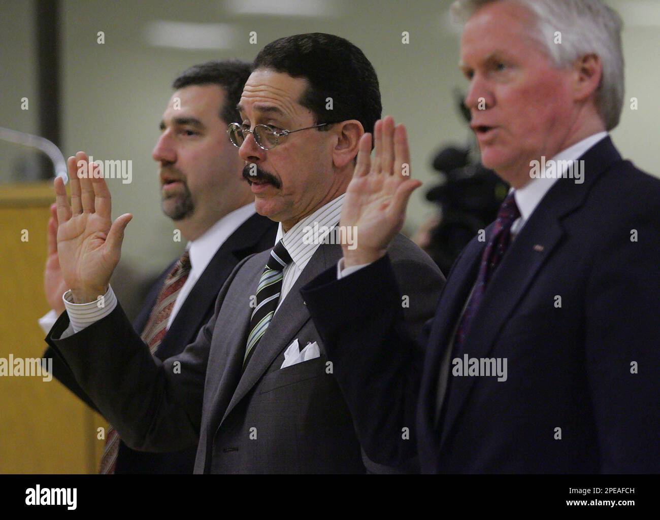 Sen. John Ford, D-Memphis, center, swears an oath alongside his ...