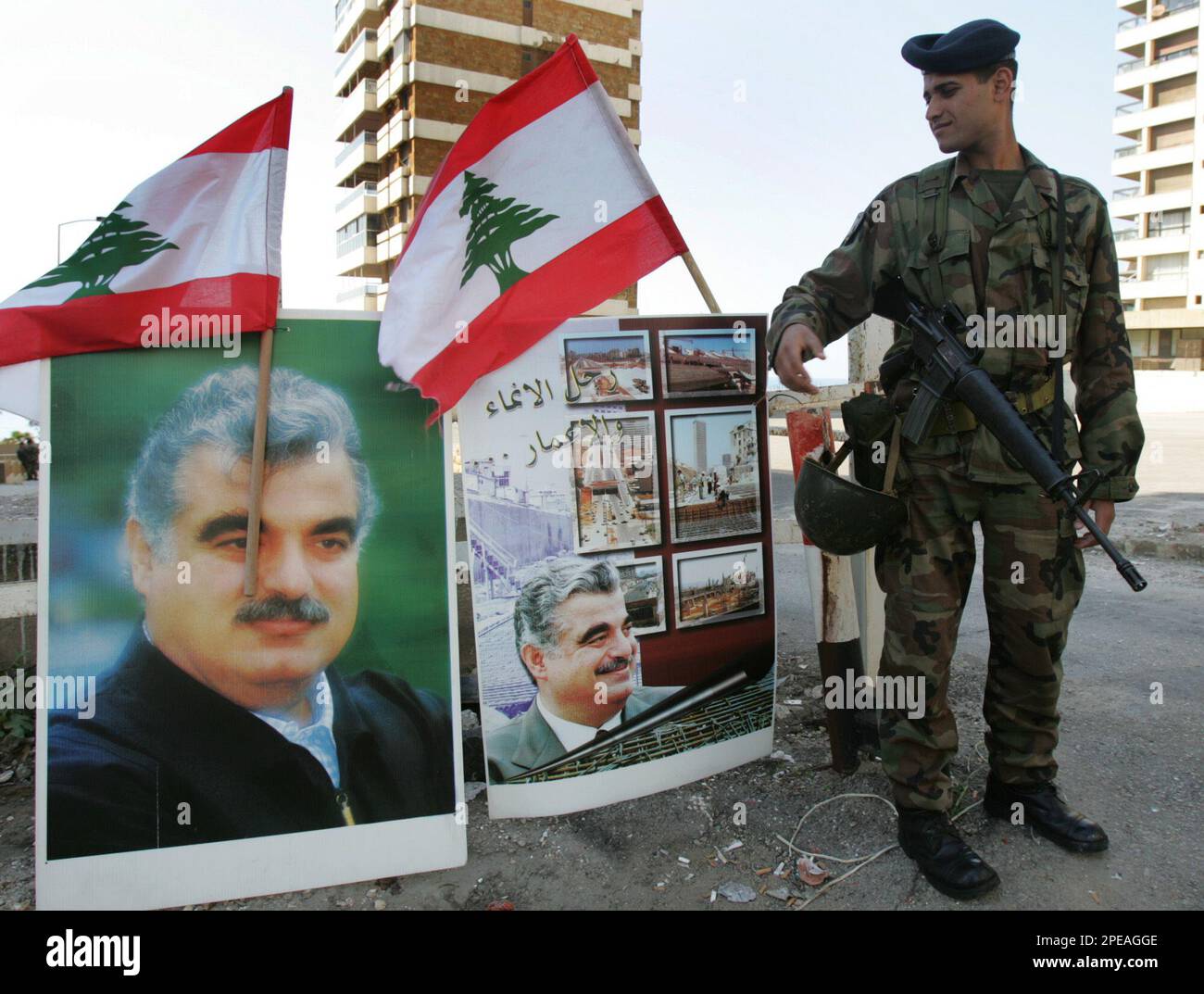 A Lebanese soldier stands guard at the gates of the former Syrian ...