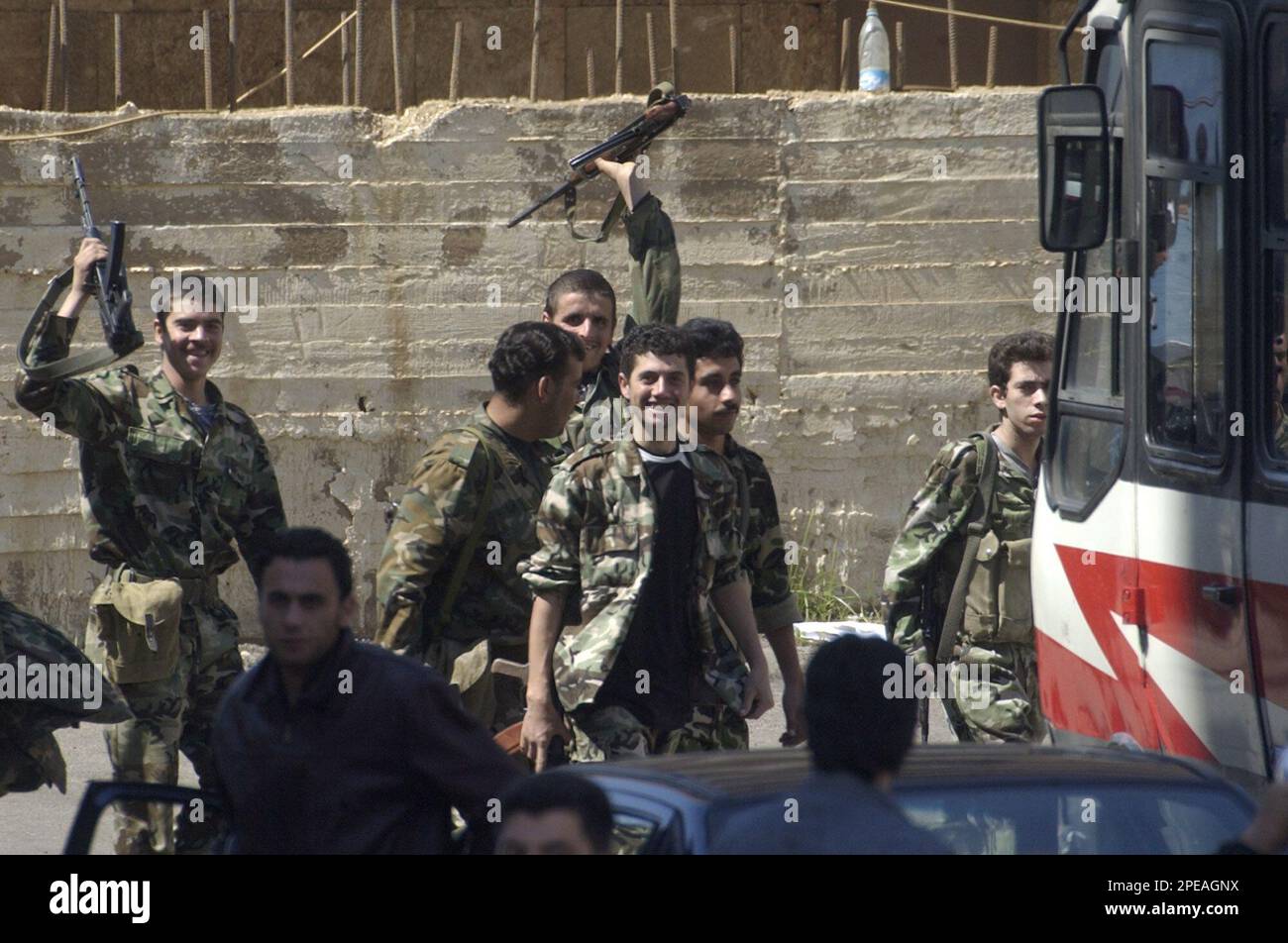 Syrian military intelligence agents leave their office at Ramlet el ...