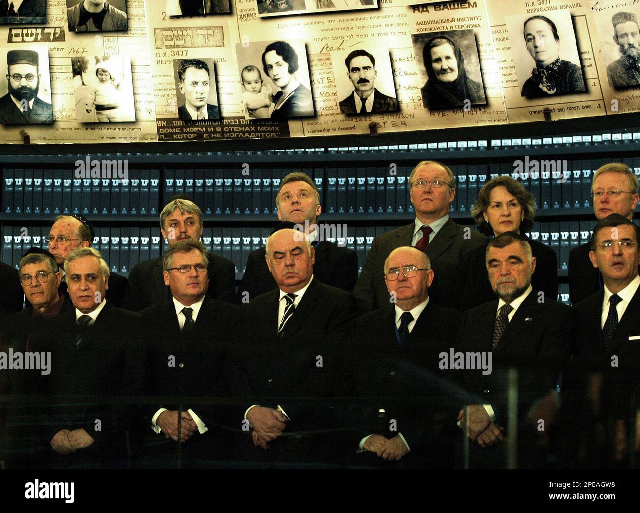 Israeli President Moshe Katsav, second left, stands between Avner ...