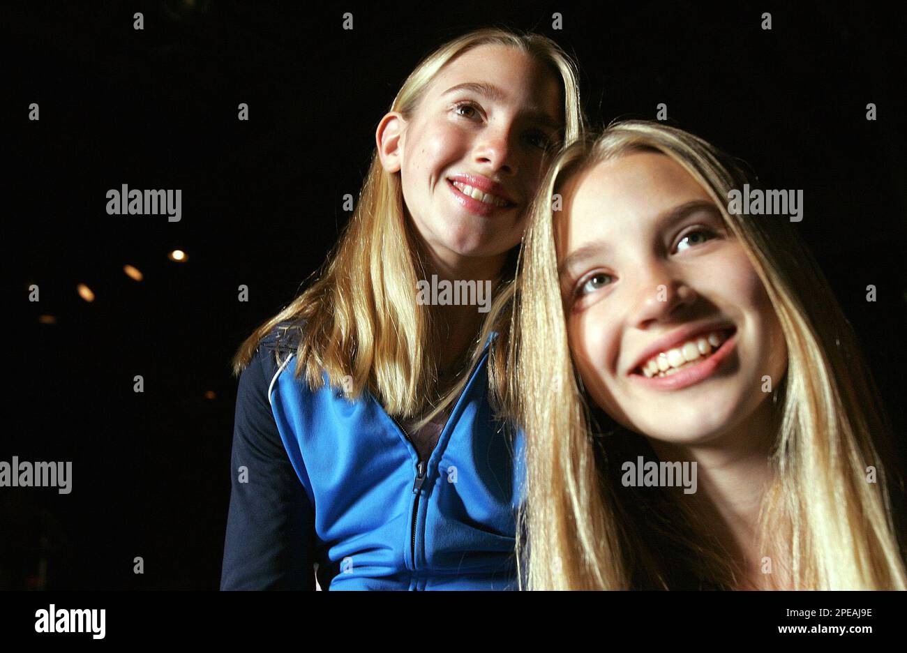 Asya, 13, left, and her sister Chloe, 11, (last names not given) of the ...