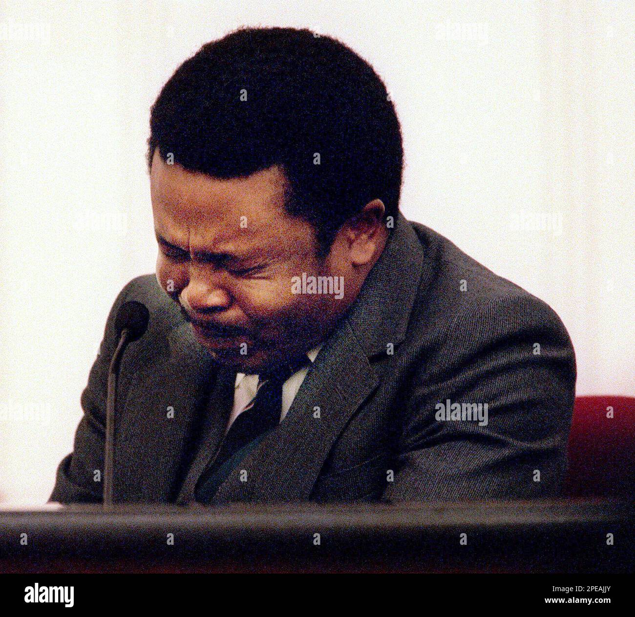 Peter Kupaza breaks down and cries after being asked by his lawyer if ...