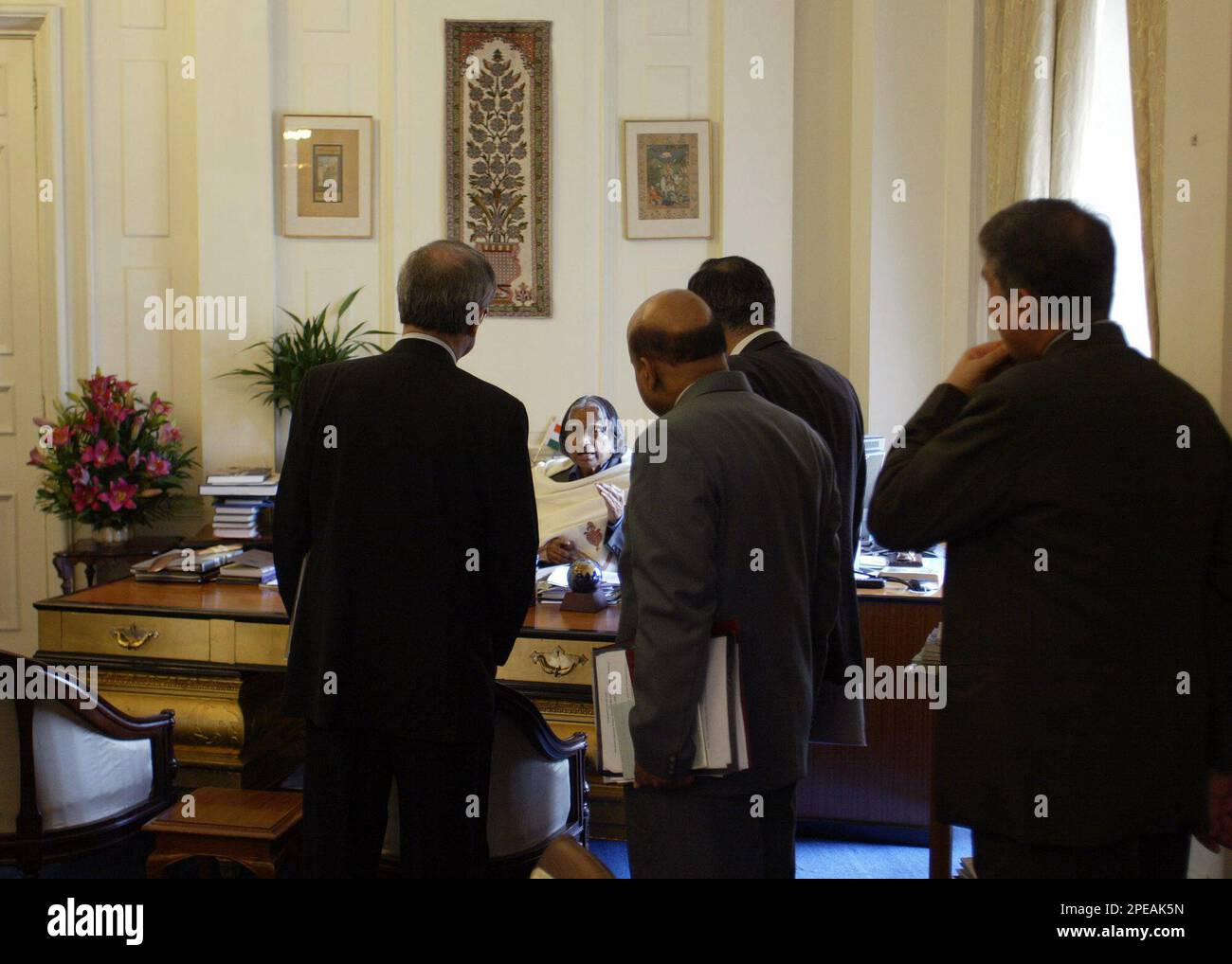Indian Presidential aides brief President A.P.J. Abdul Kalam, seated ...