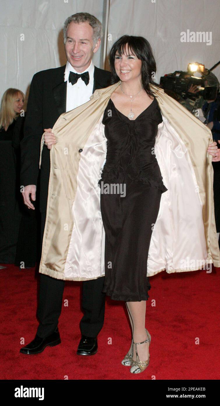 John McEnroe, left, and his wife Patti Smyth pose for photographers as ...
