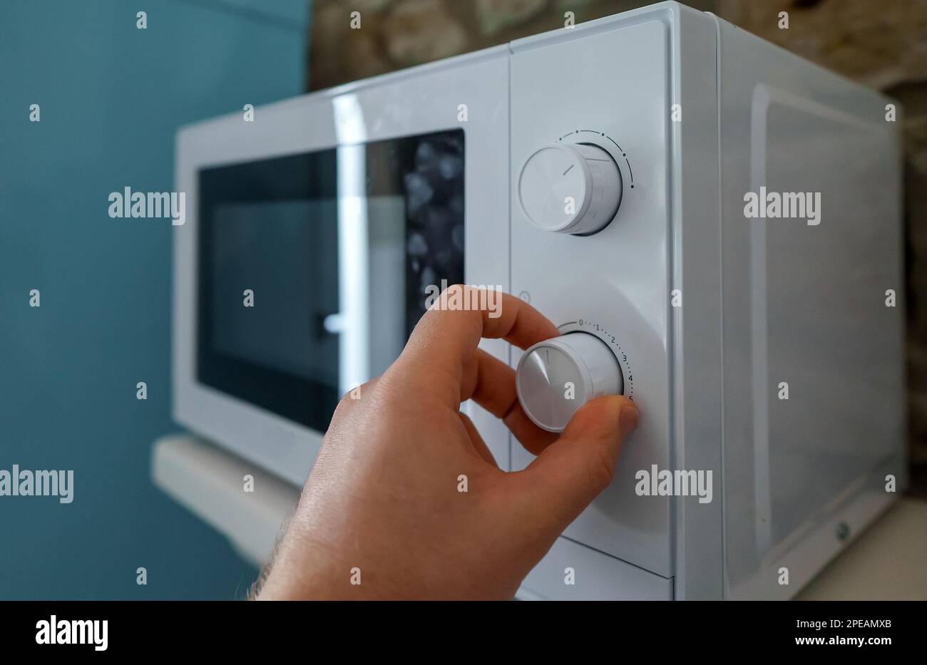 Microwave oven man hi-res stock photography and images - Alamy
