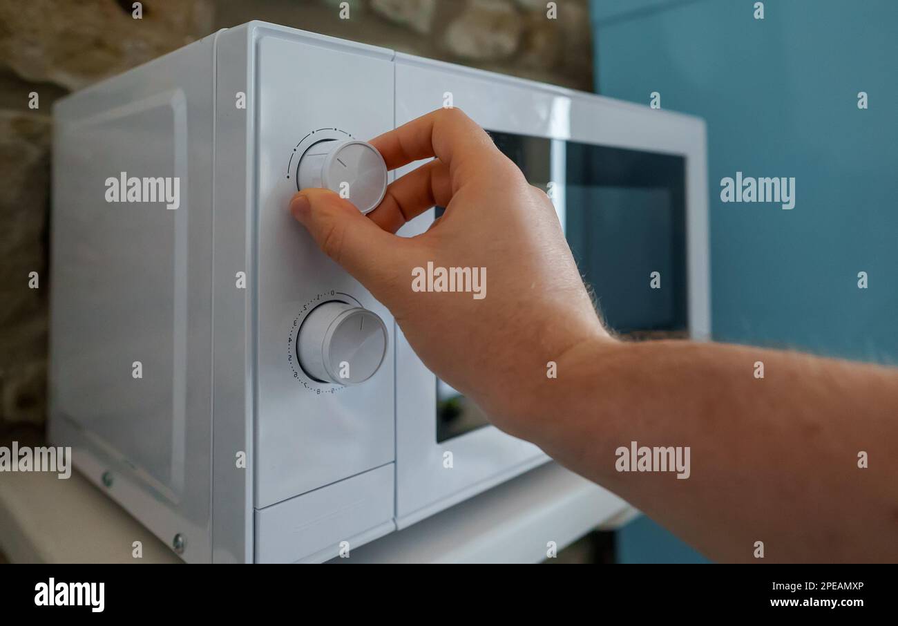 Microwave food male hi-res stock photography and images - Alamy