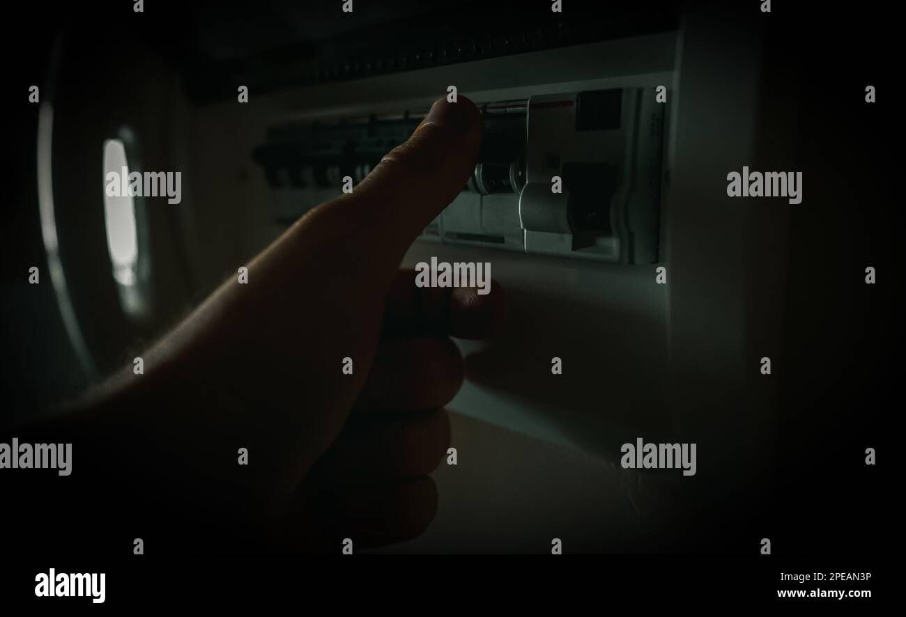 Male hand using fuse board relay Stock Photo - Alamy