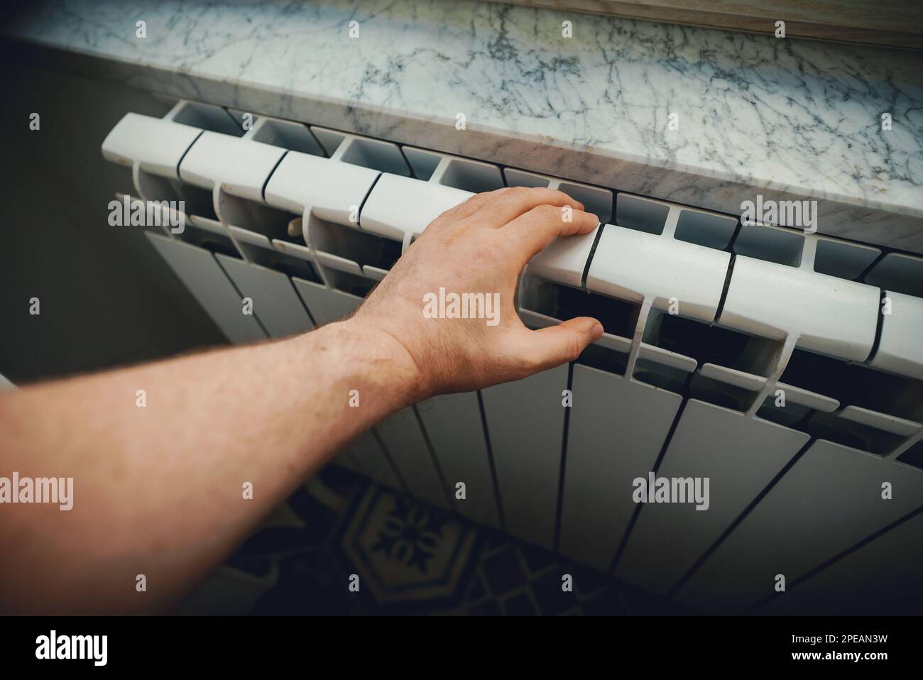 Mans hand checking temperature hi-res stock photography and images - Alamy