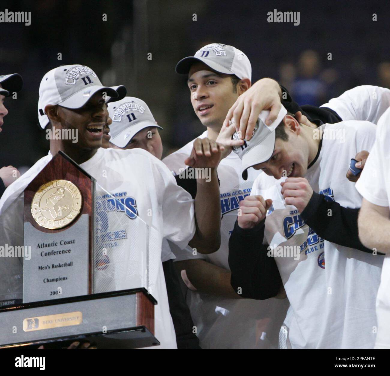 Duke players, from left, Daniel Ewing, David McClure and J.J. Redick ...
