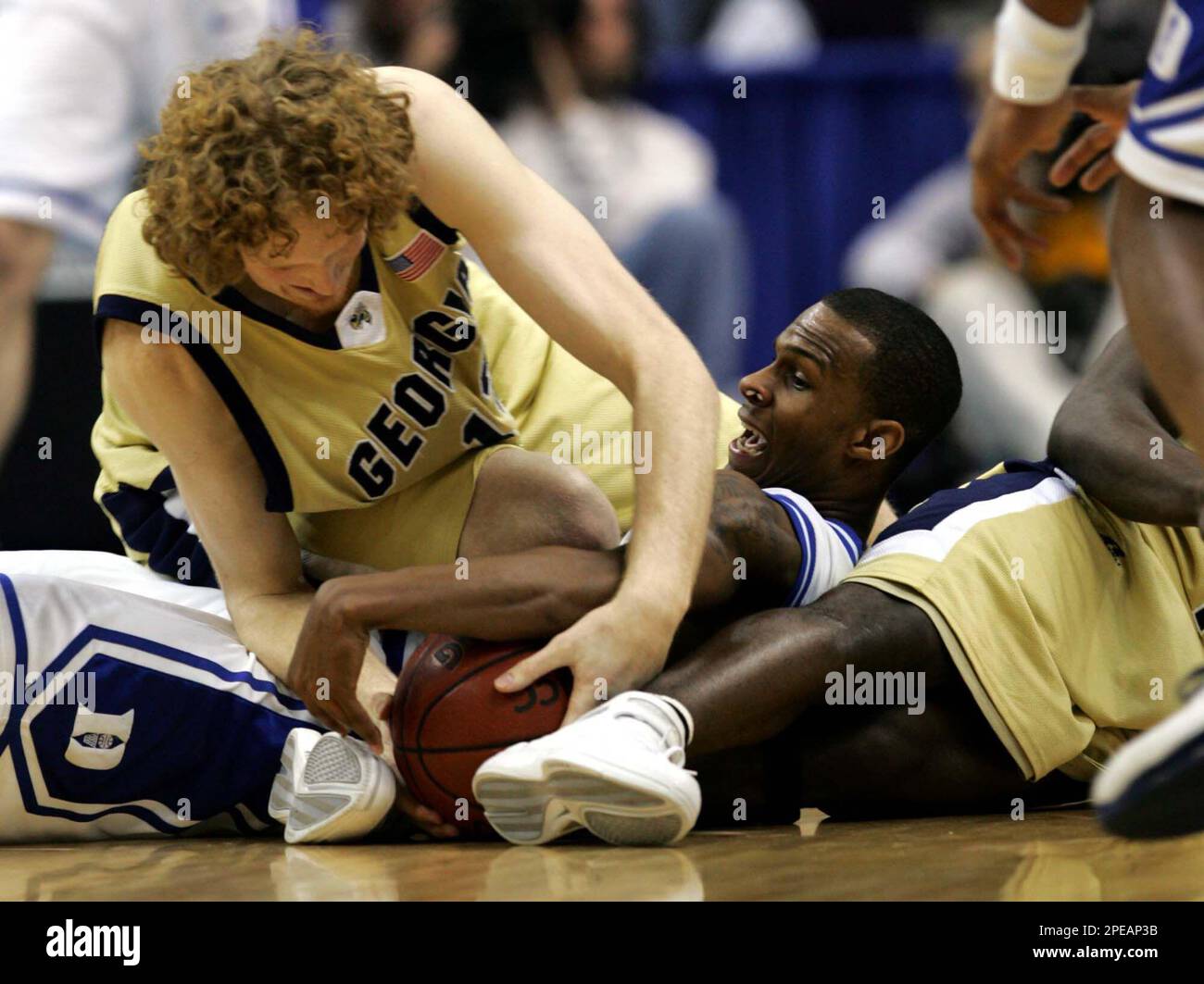 Georgia Tech's Luke Schenscher, left, and Duke's Daniel Ewing battle ...