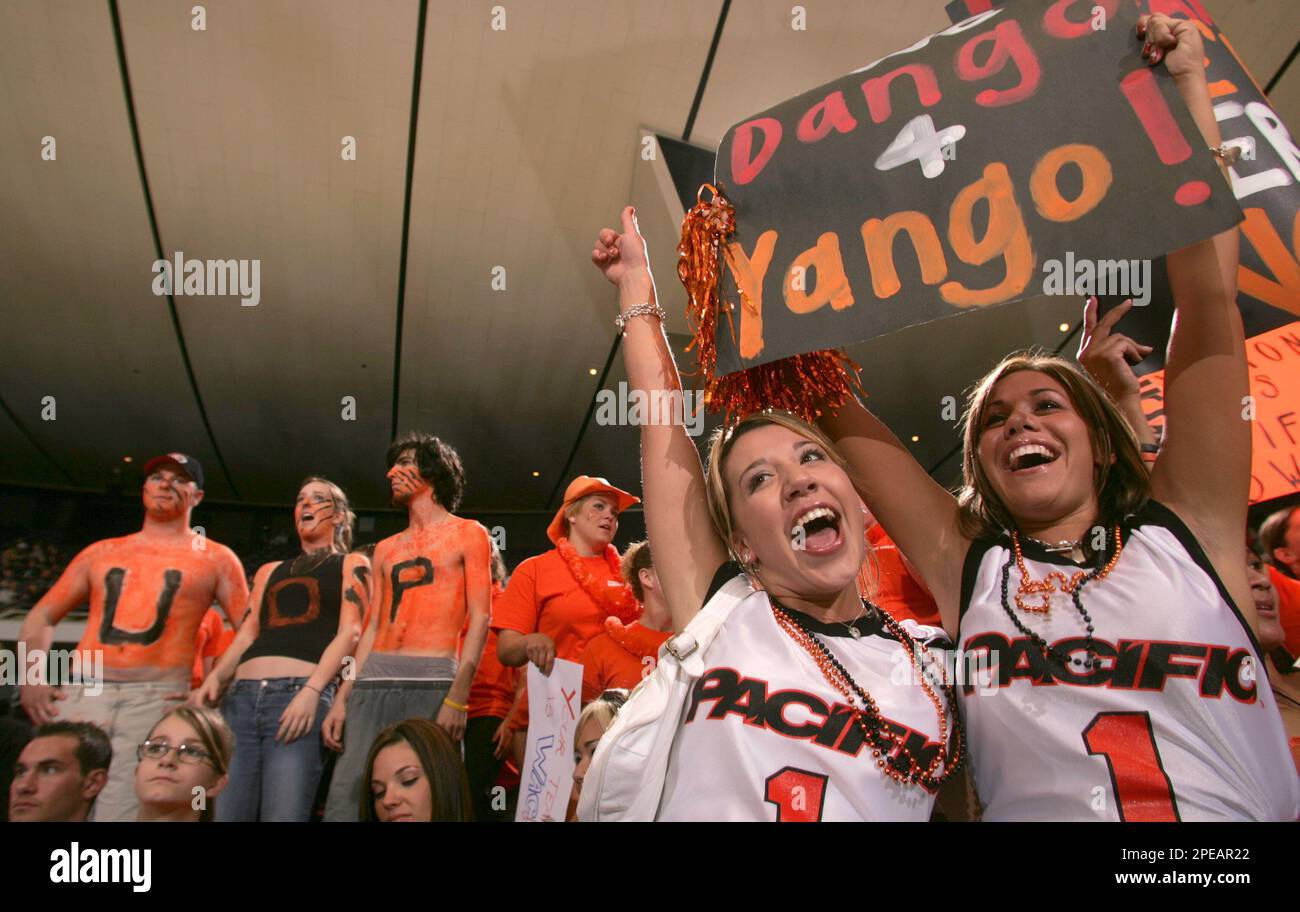 Pacific fans Shiloah Stone, foreground left, and Natasha Hops yell ...