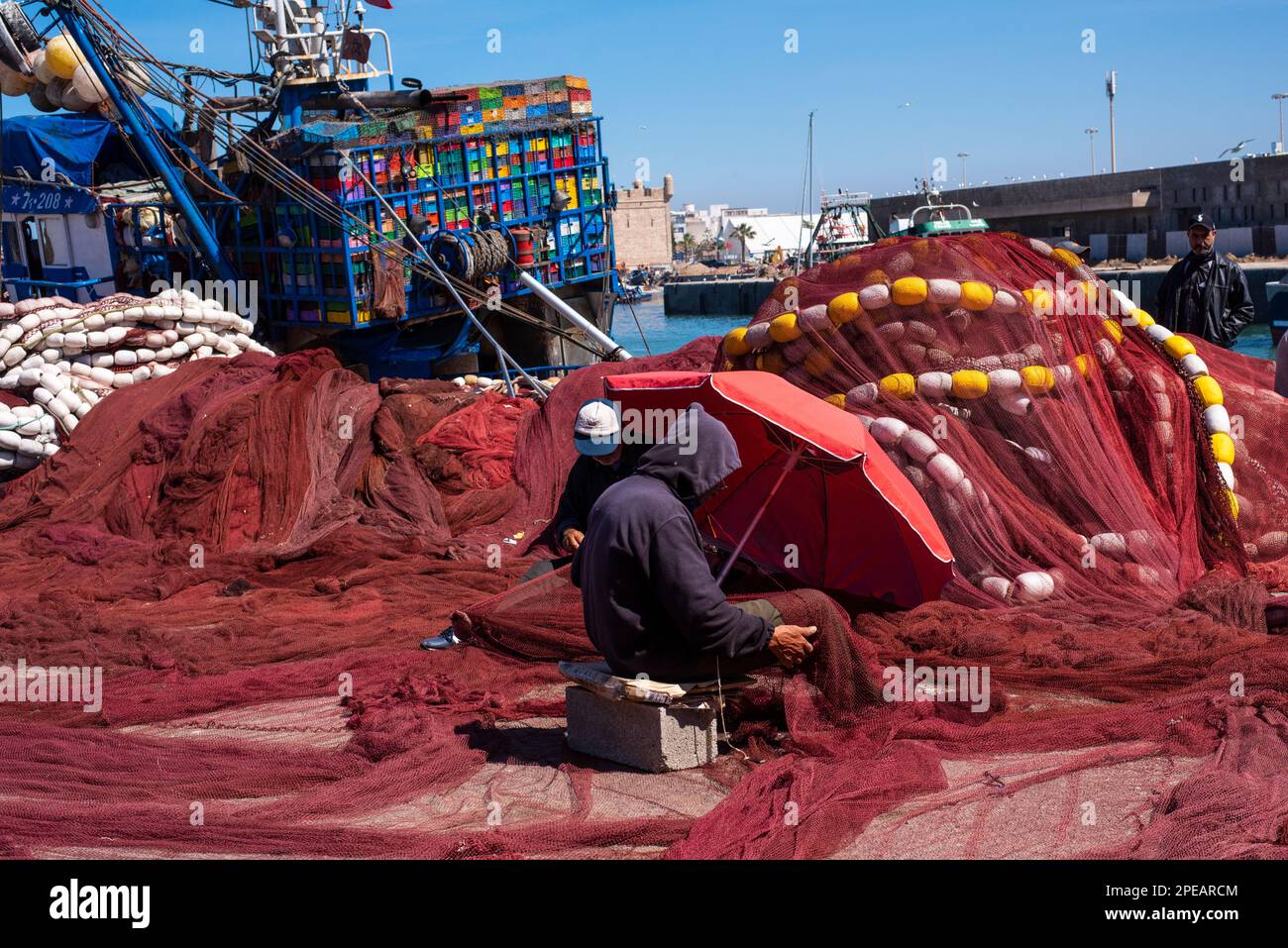 Fisherman cleaning fish in street hi-res stock photography and images ...
