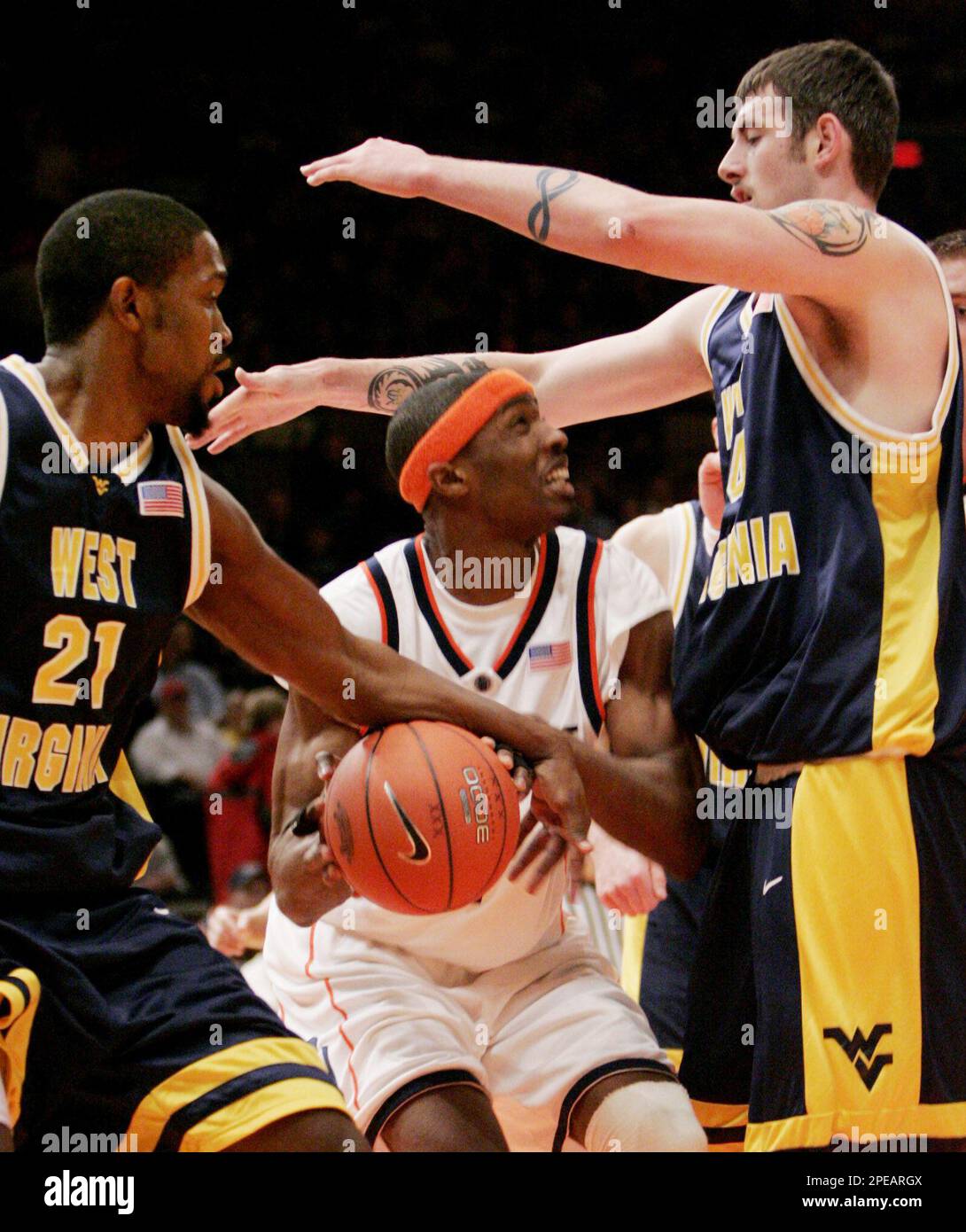 West Virginia's Frank Young, left, steals the ball from Syracuse's ...