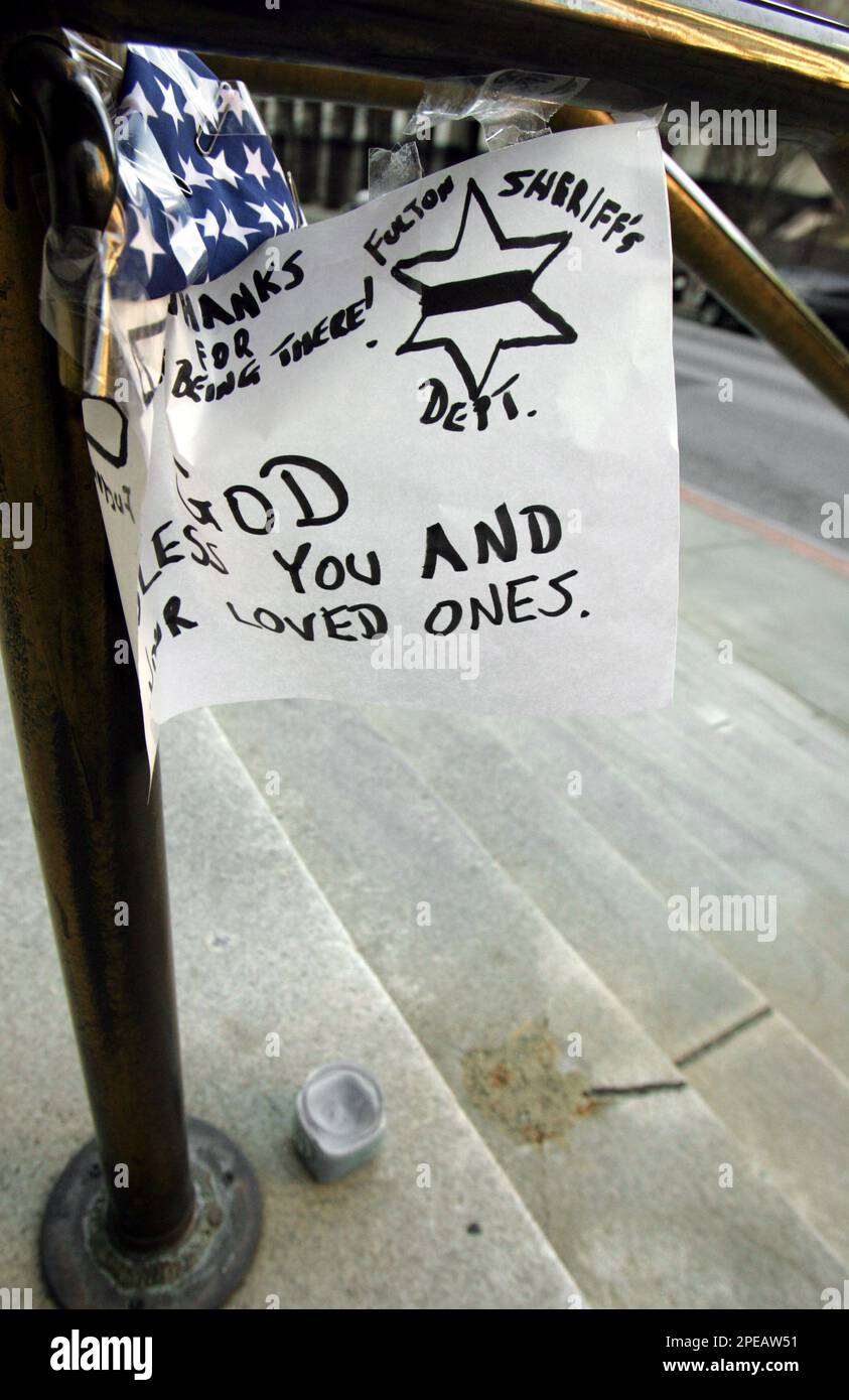 A small memorial adorns the railing on the front steps of the Lewis R ...