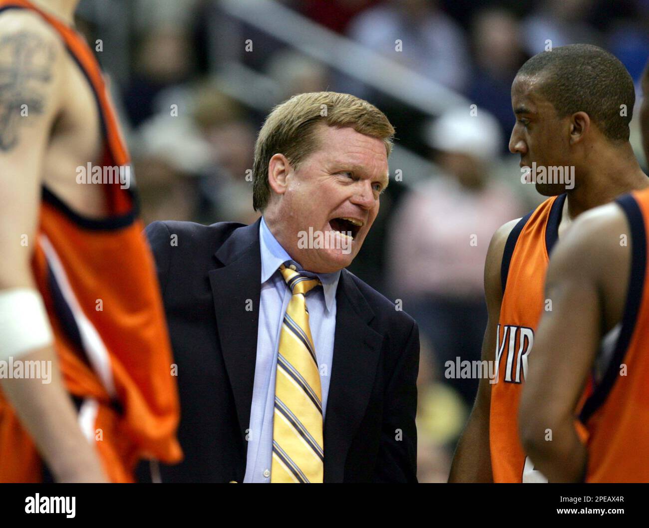 Virginia coach Pete Gillen talks to his team at a time out during their ...
