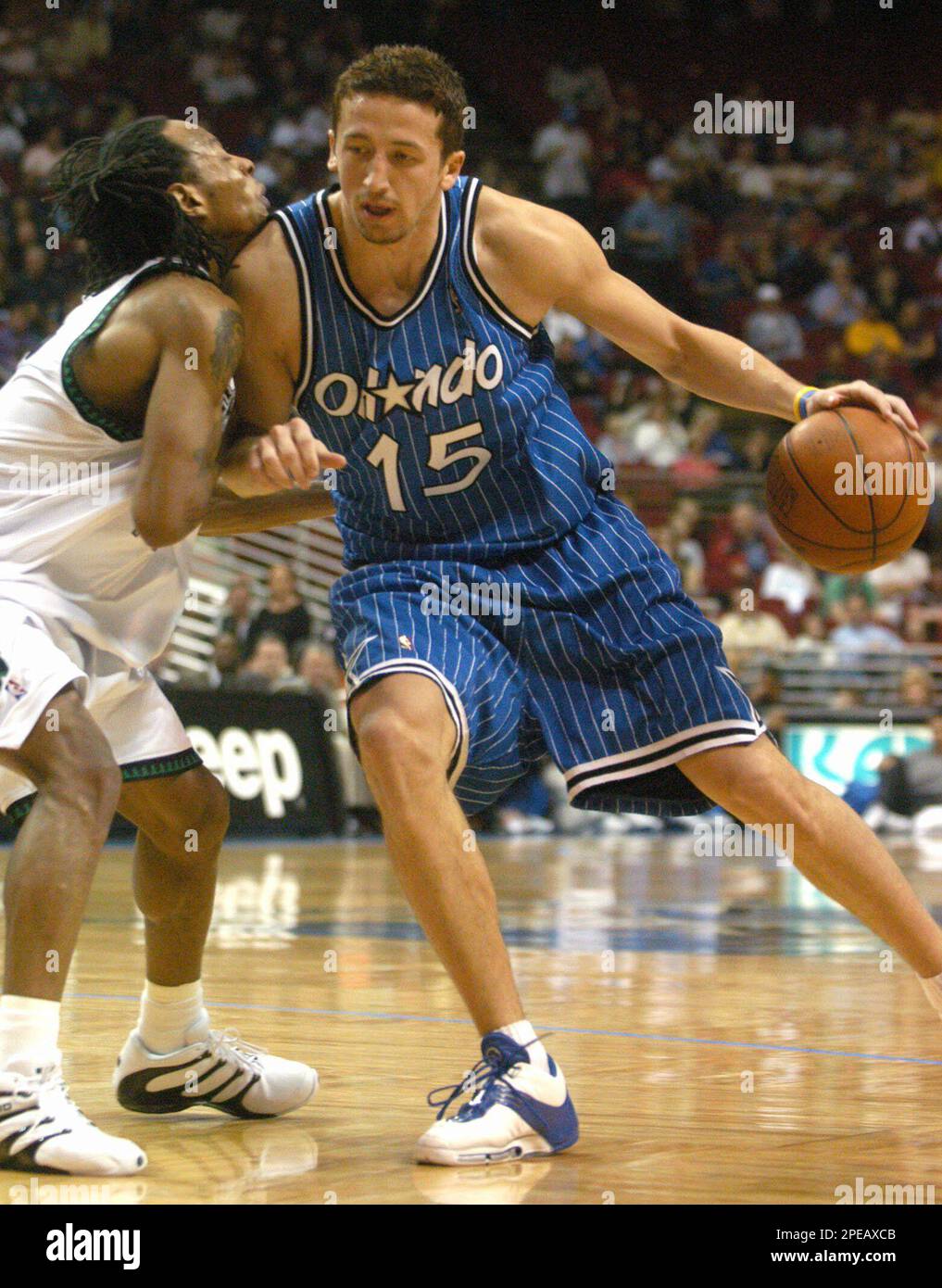 Minnesota Timberwolves guard Troy Hudson, left, takes a charge to the ...